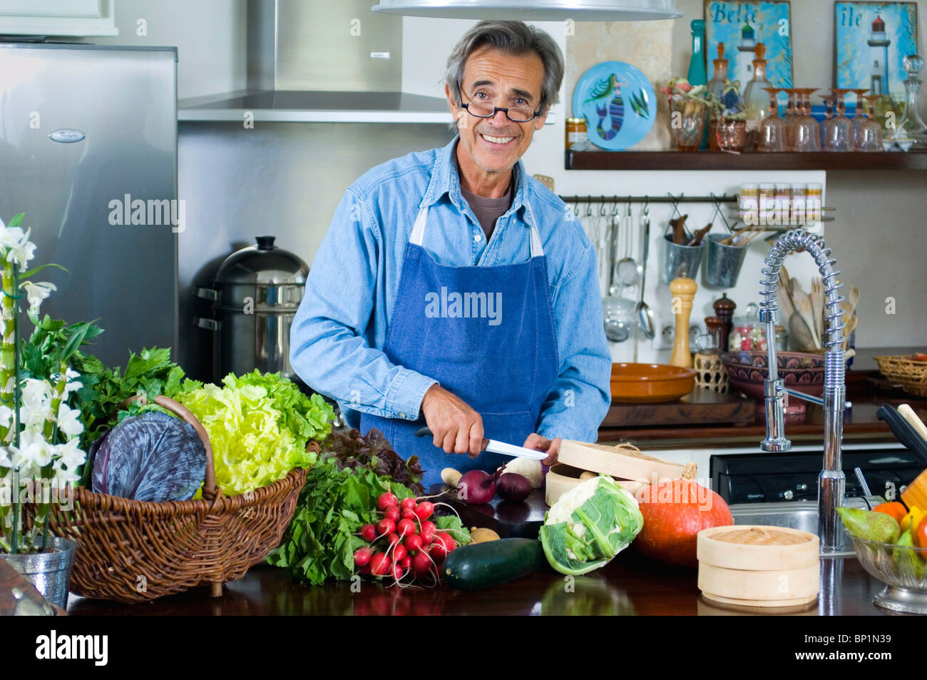 Man cooking in kitchen Stock Photo - Alamy