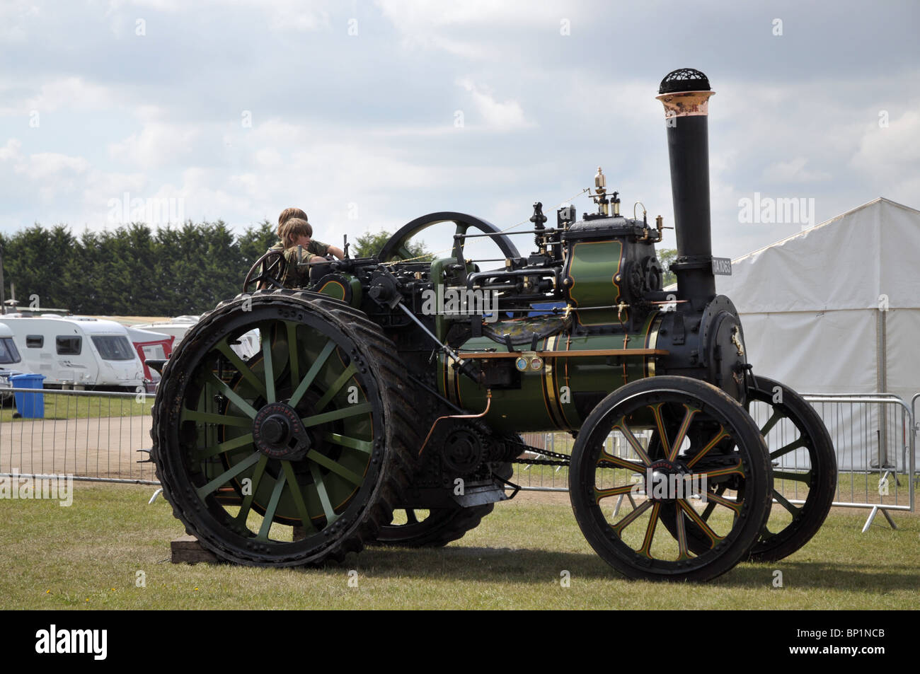 some children on a steam engine before it drives into the parade ring ...
