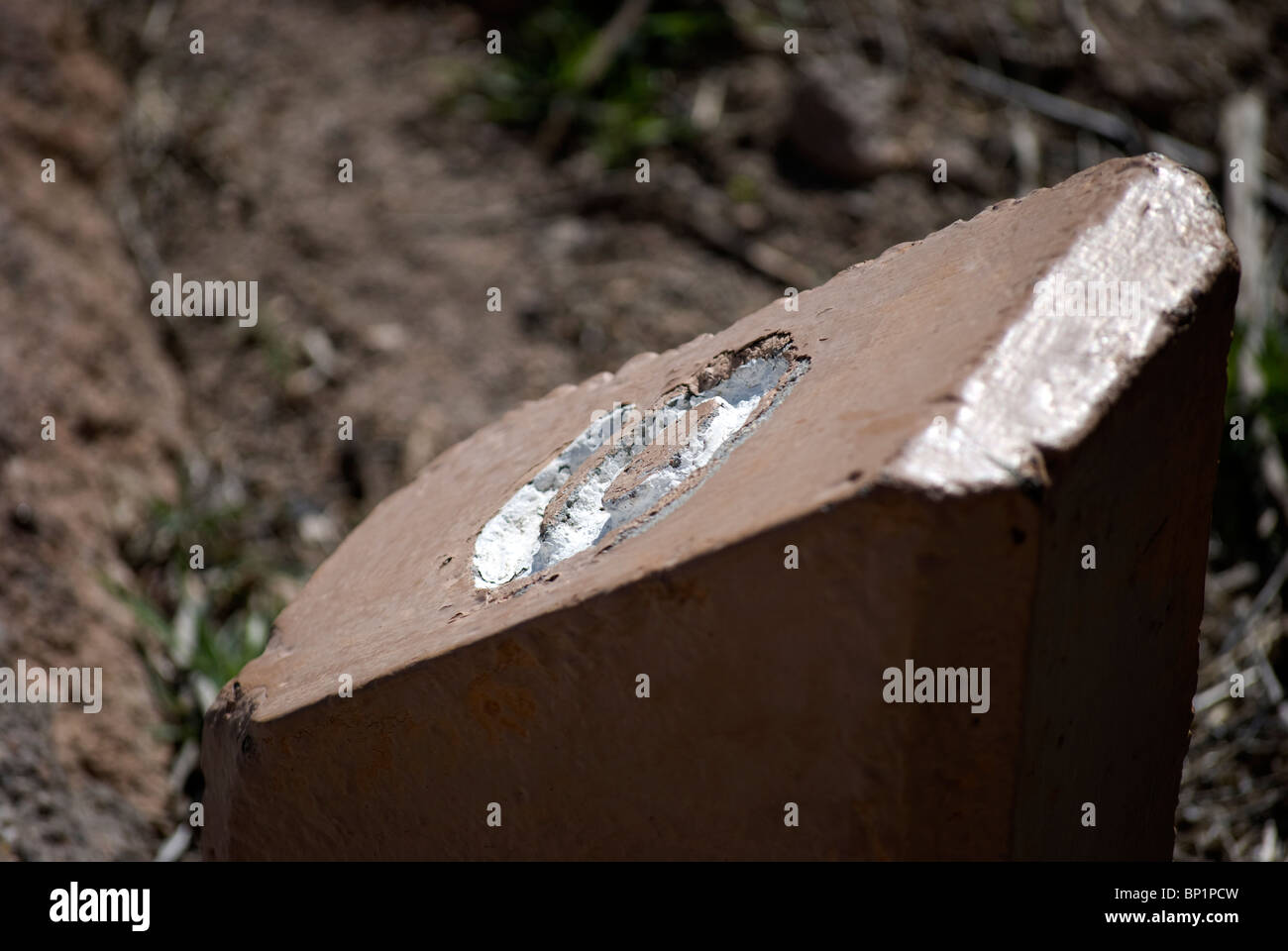 Concrete signpost with the number nine denoting a point of interest ...