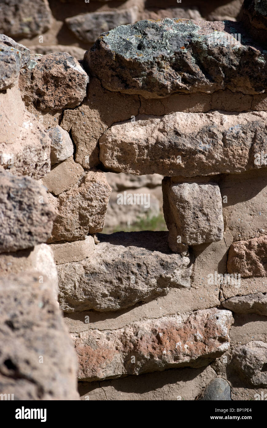 Stabilized tuff masonry wall with vent hole from the Tyuonyi Pueblo ...