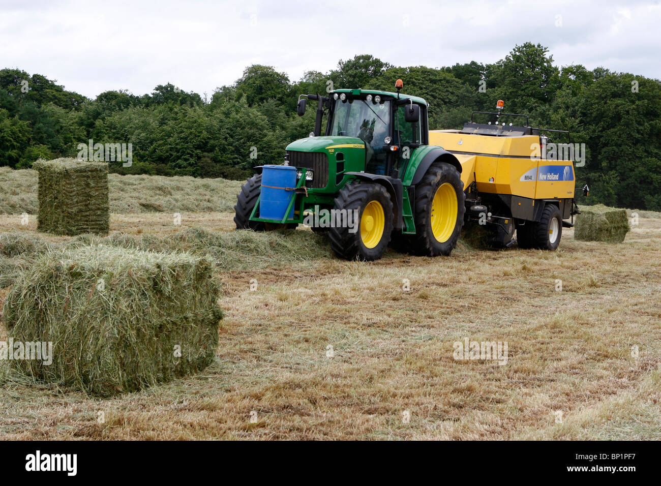 Haylage bale making for horse feed in the Chiltern Hills, South ...