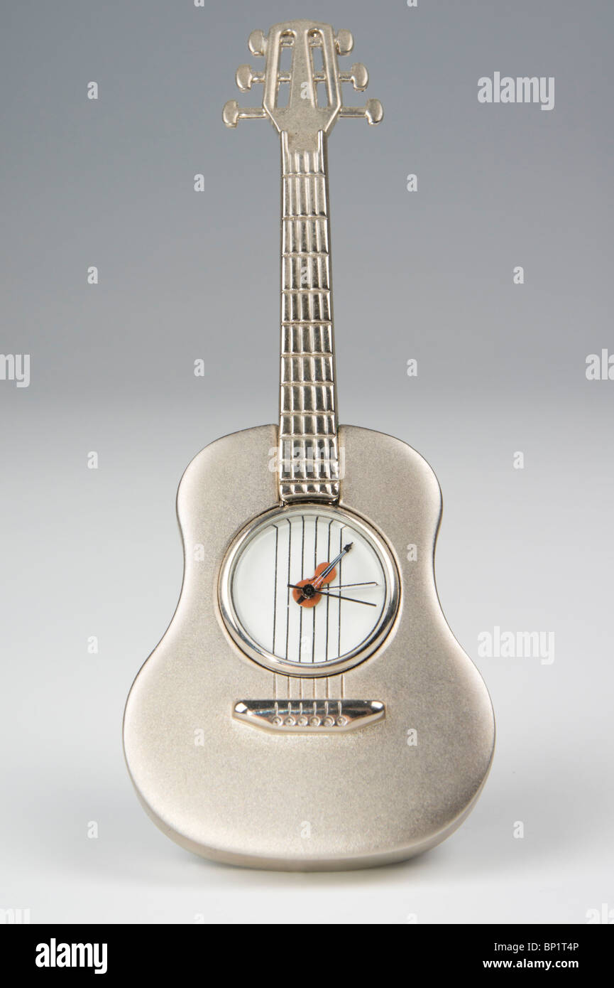 Small silver coloured metal guitar 'clock' with a waytch sized face ...