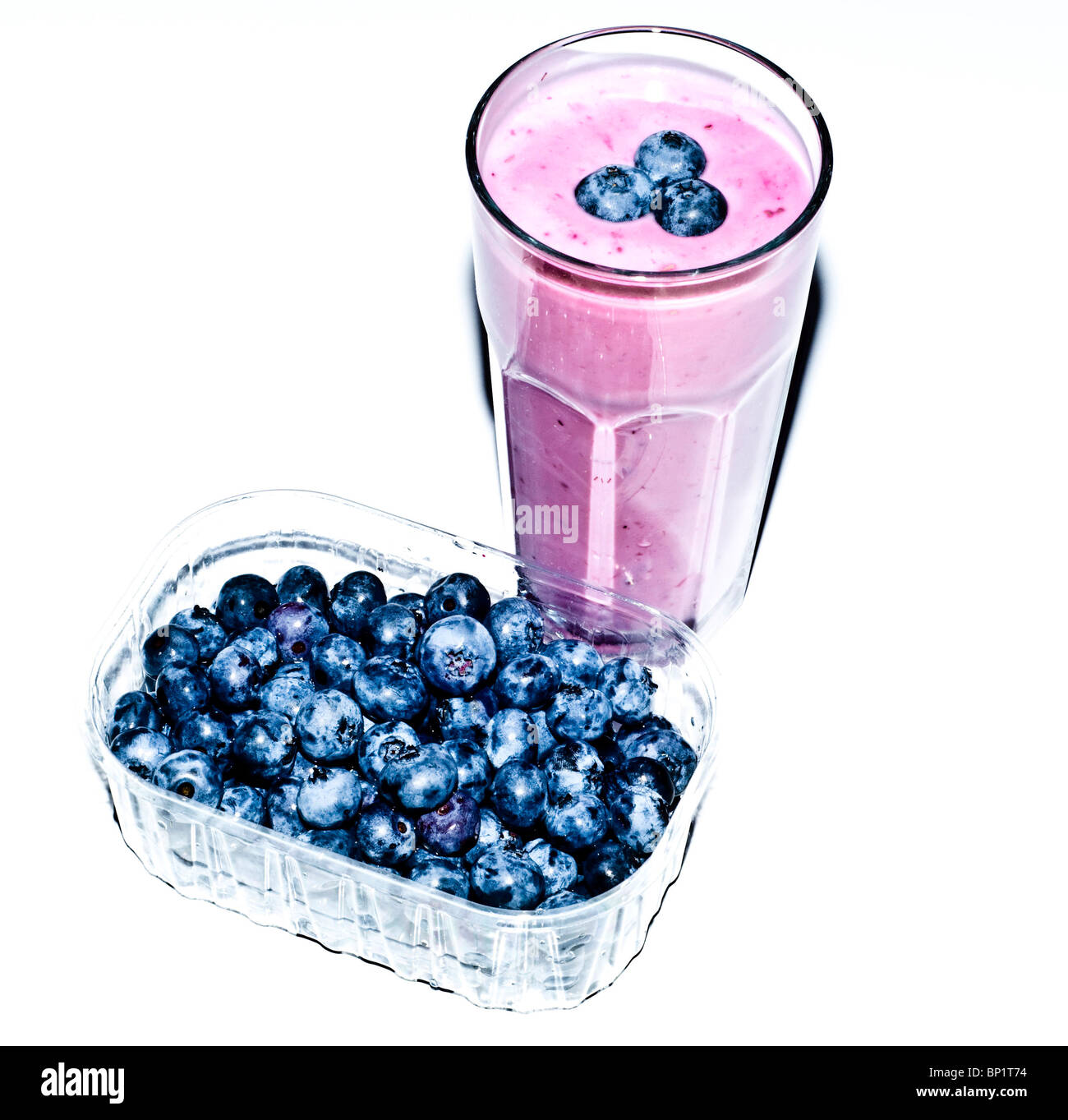 Fresh self-made blueberry shake and blueberries in transparent box ...