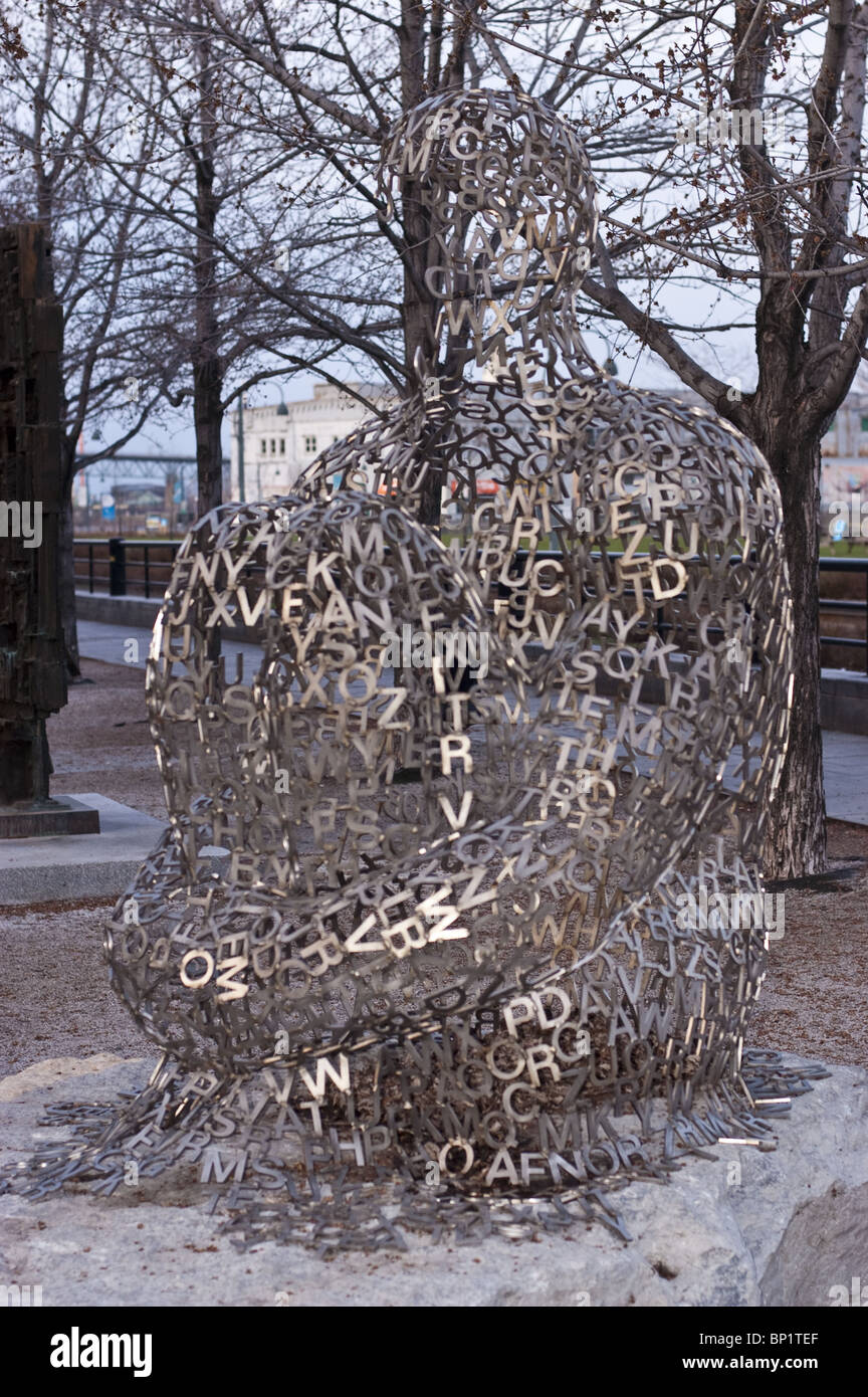 Sitting man made of metal letters statue at montreal port hi-res stock ...