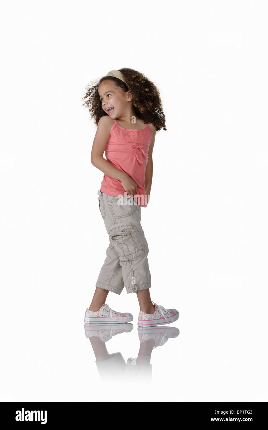 Young Girl on White Looking Back Over Shoulder Stock Photo - Alamy