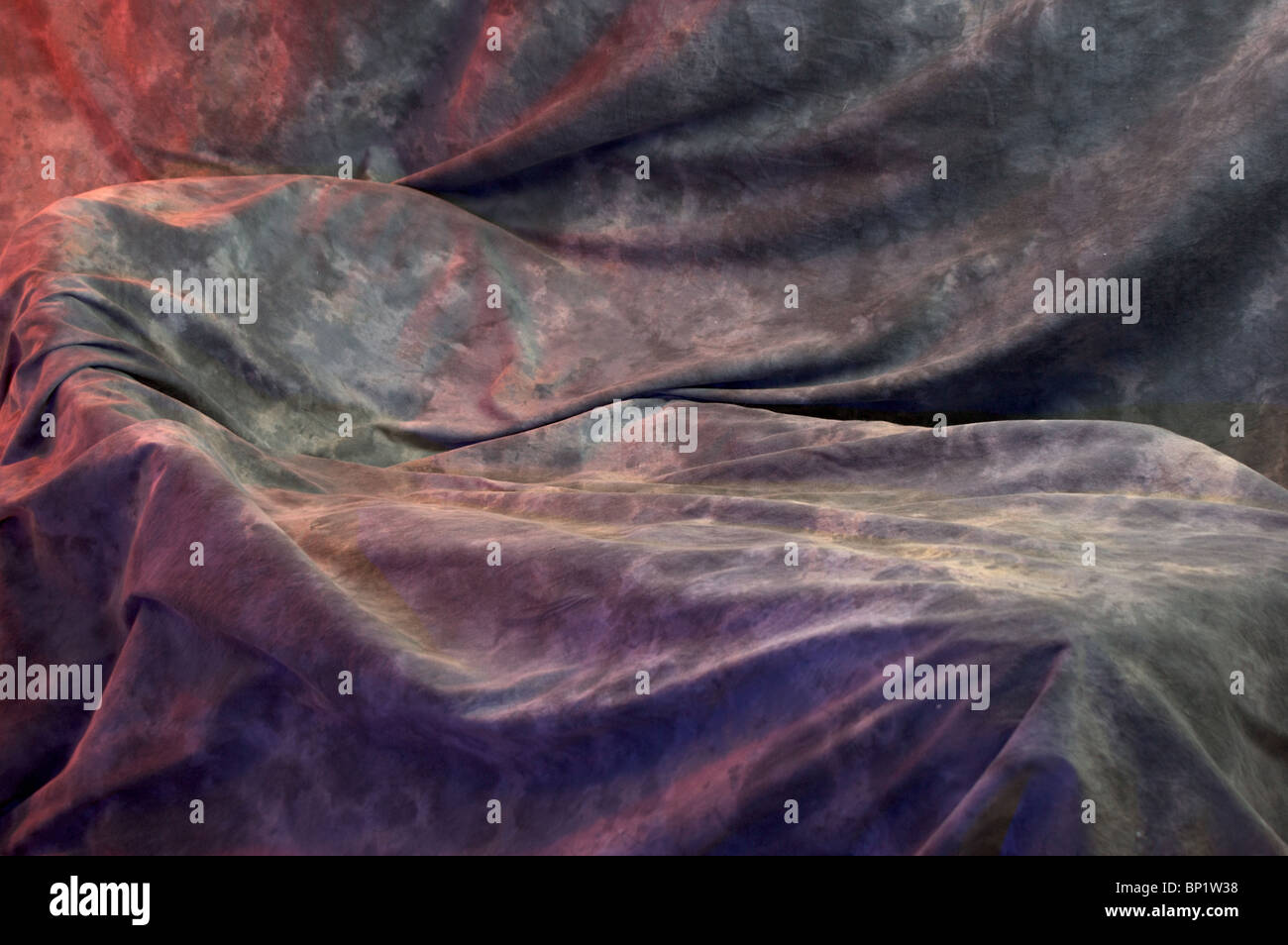 Mottled gray backdrop cloth draped over sofa with wrinkles Stock Photo ...