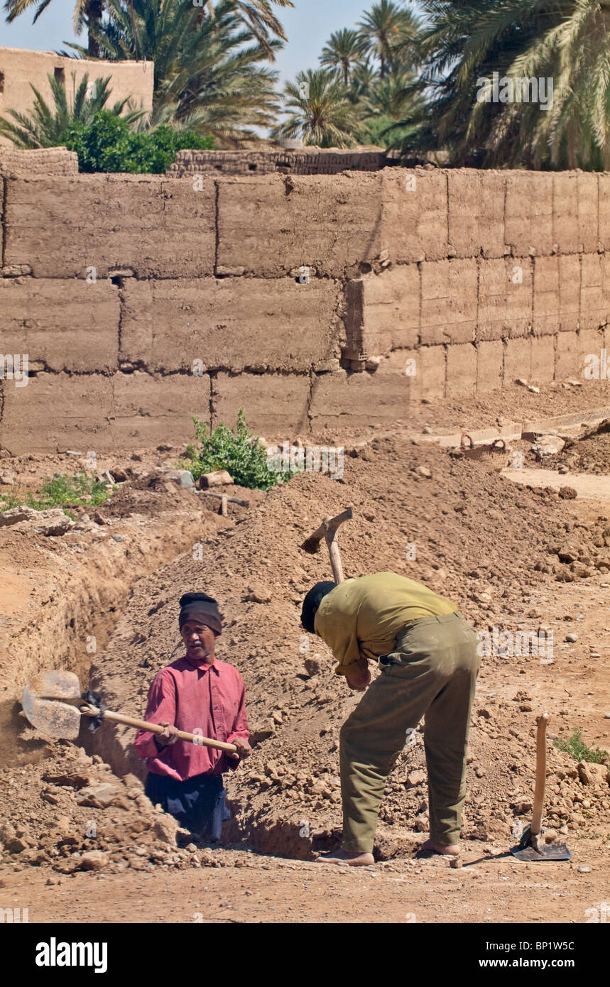 Men dig water in hi-res stock photography and images - Alamy