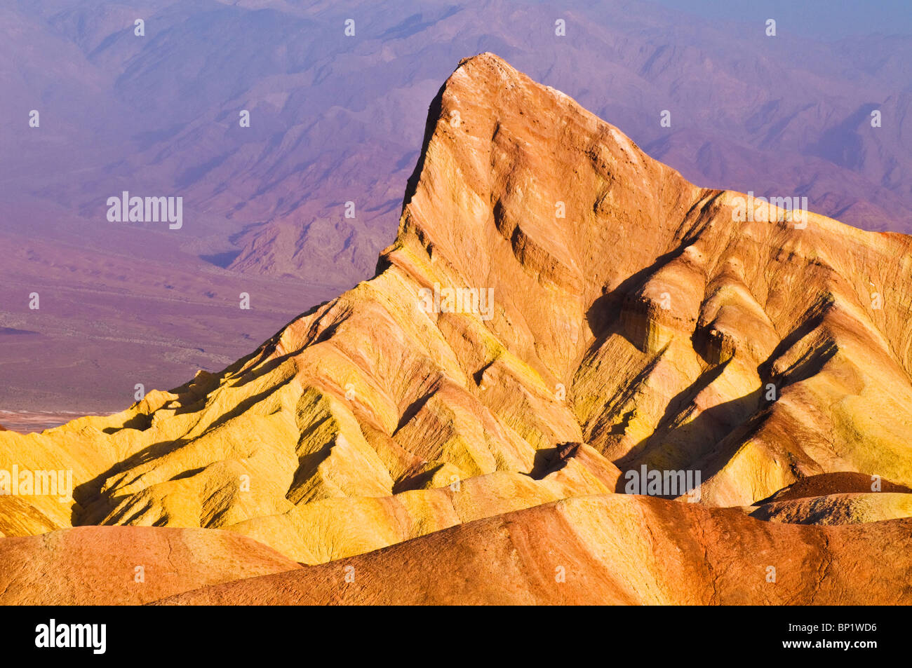 Dawn light on Manly Beacon from Zabriskie Point, Death Valley National ...