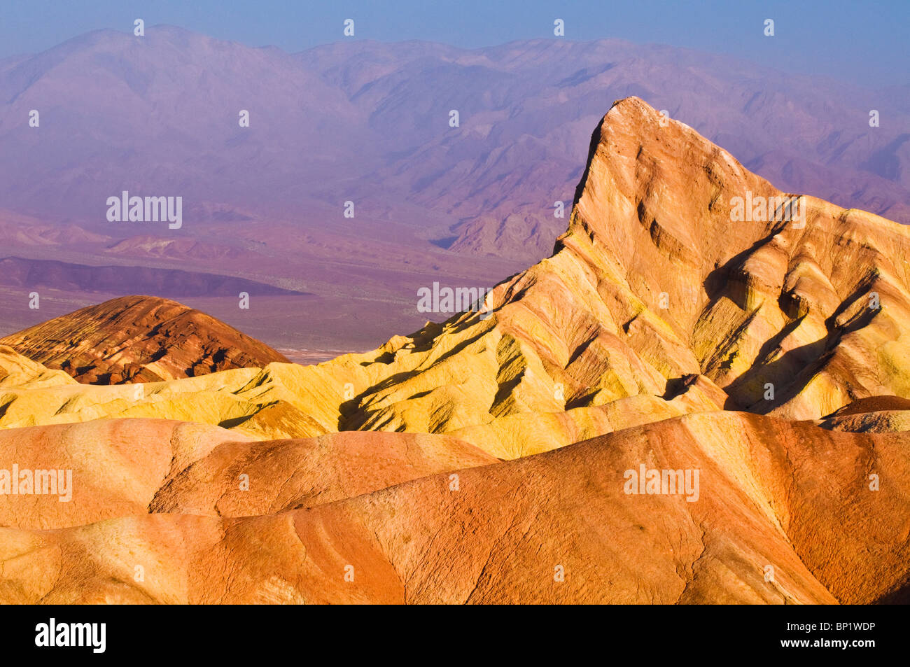 Dawn light on Manly Beacon from Zabriskie Point, Death Valley National ...