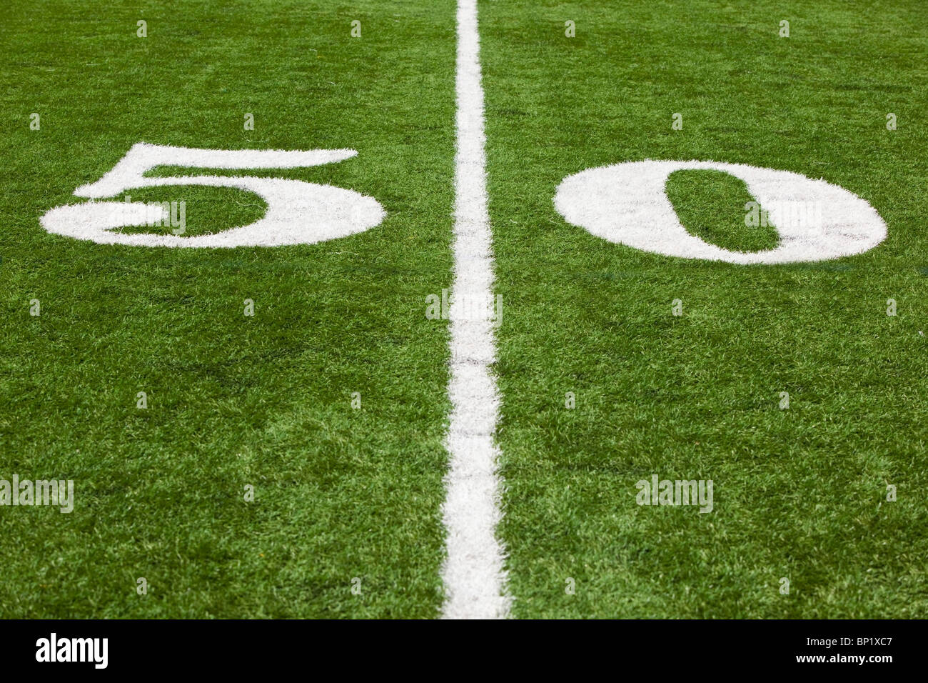 The 50 Yard Line Marked On A Football Field Stock Photo - Alamy