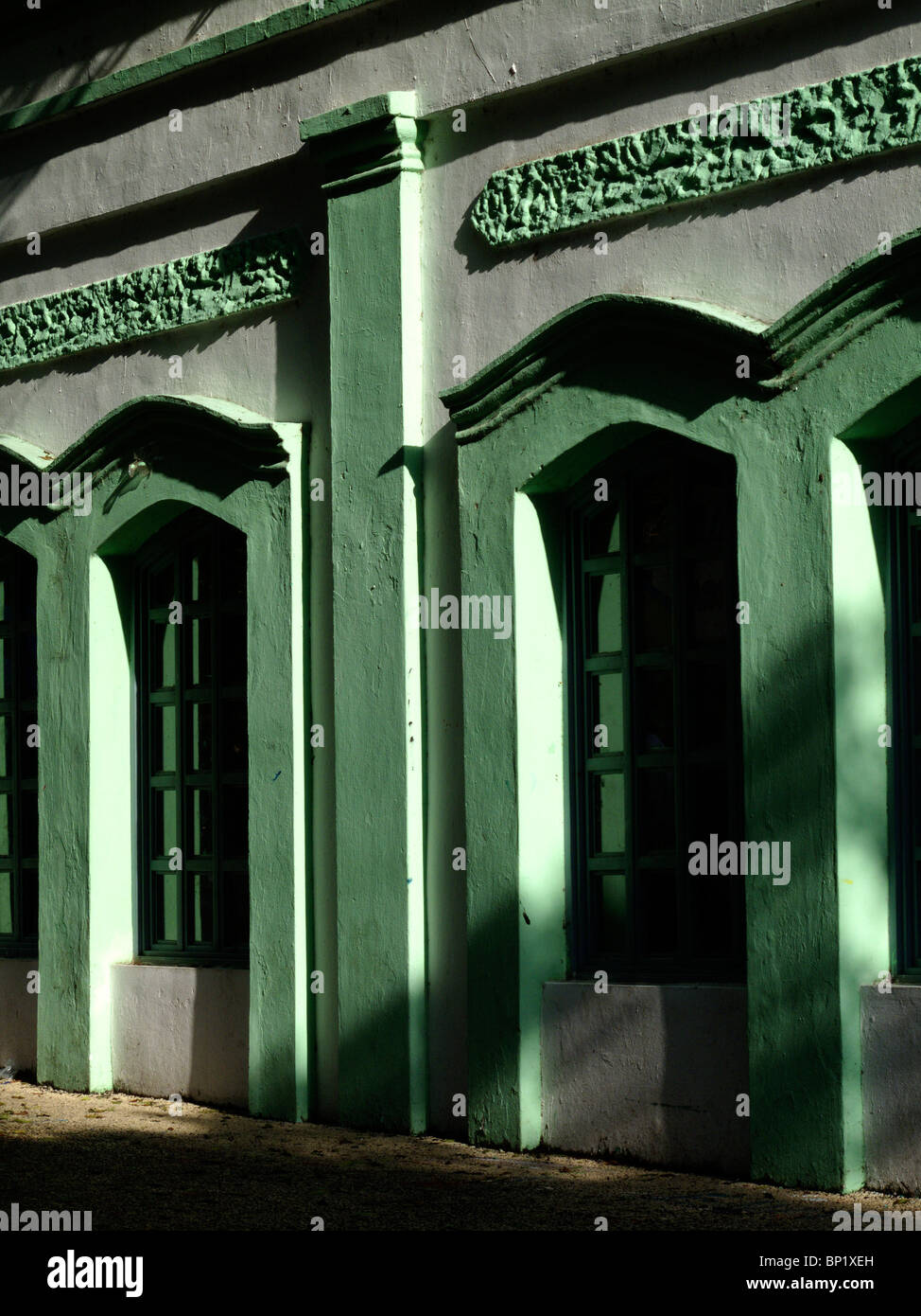 Sunlight on a green and white building in Palenque in Mexico Stock ...
