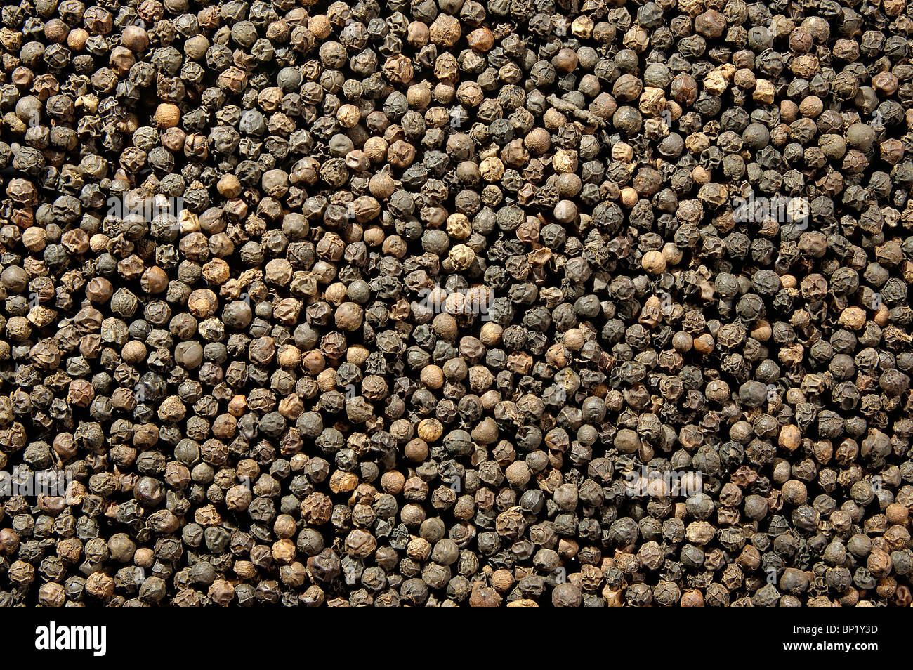 Texture Black pepper balls isolated Stock Photo - Alamy
