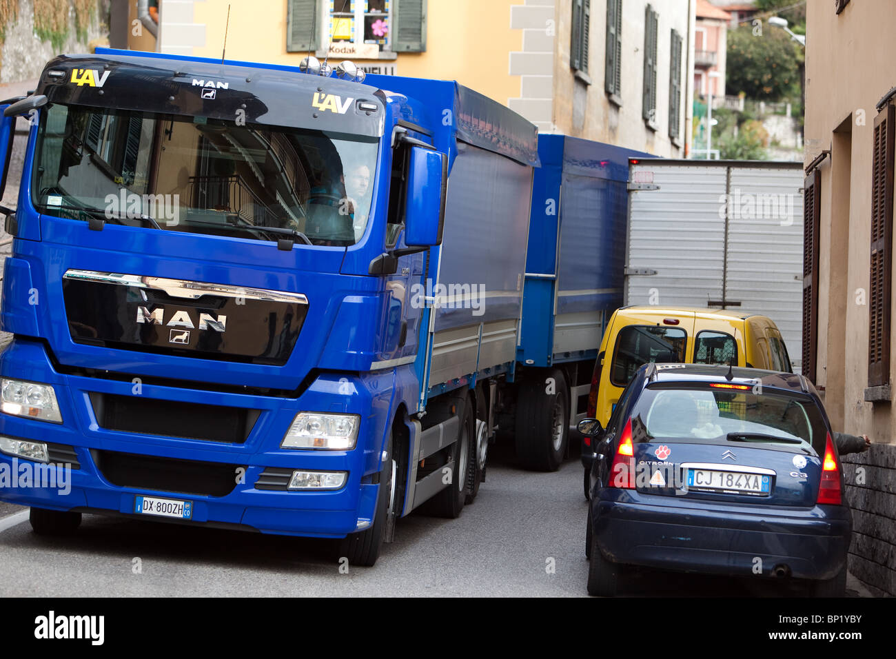 Haulage lorry and trailer navigating narrow Italian streets. Italian ...