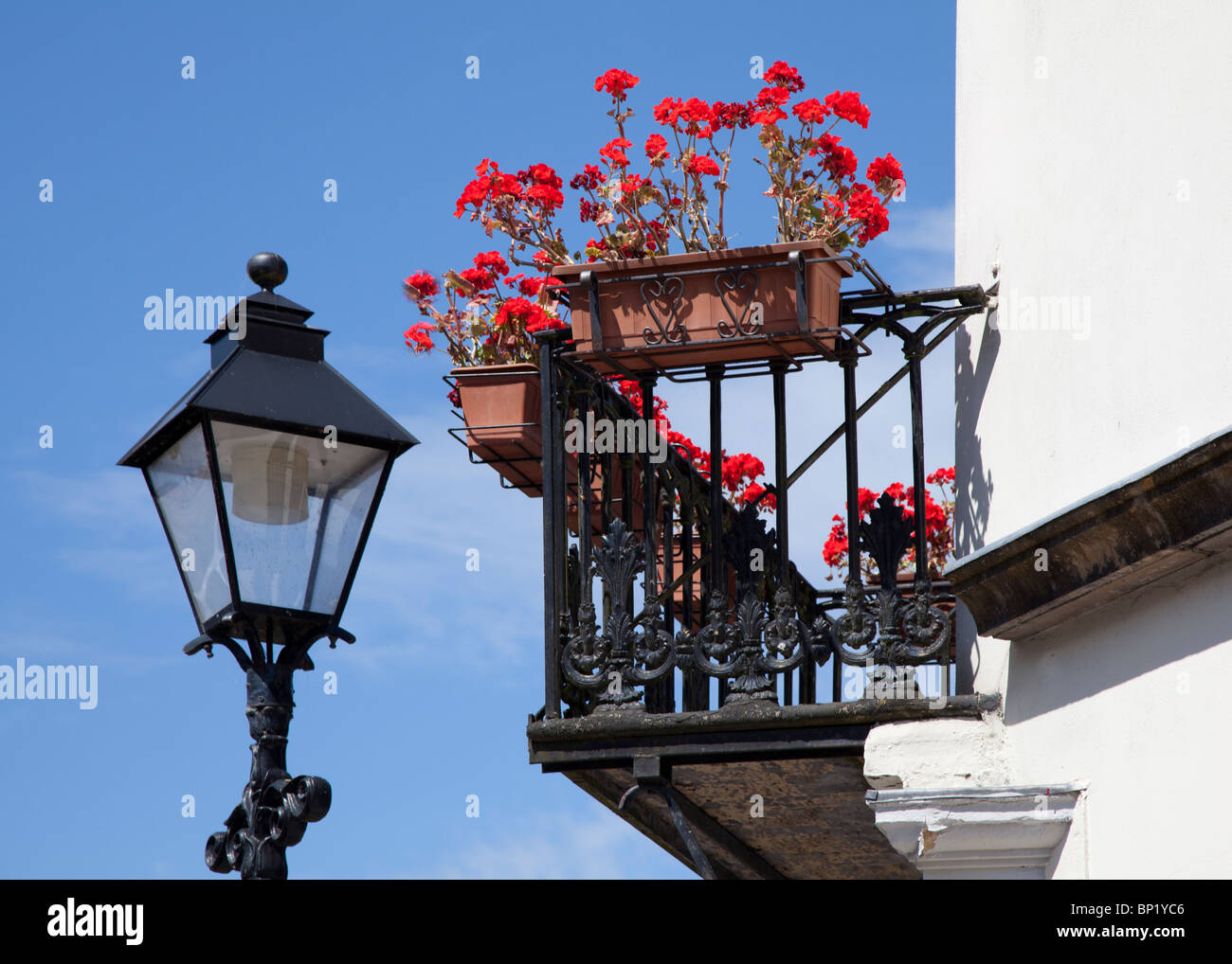 Street light and balcony with window box and flowers at Castle Cary in ...