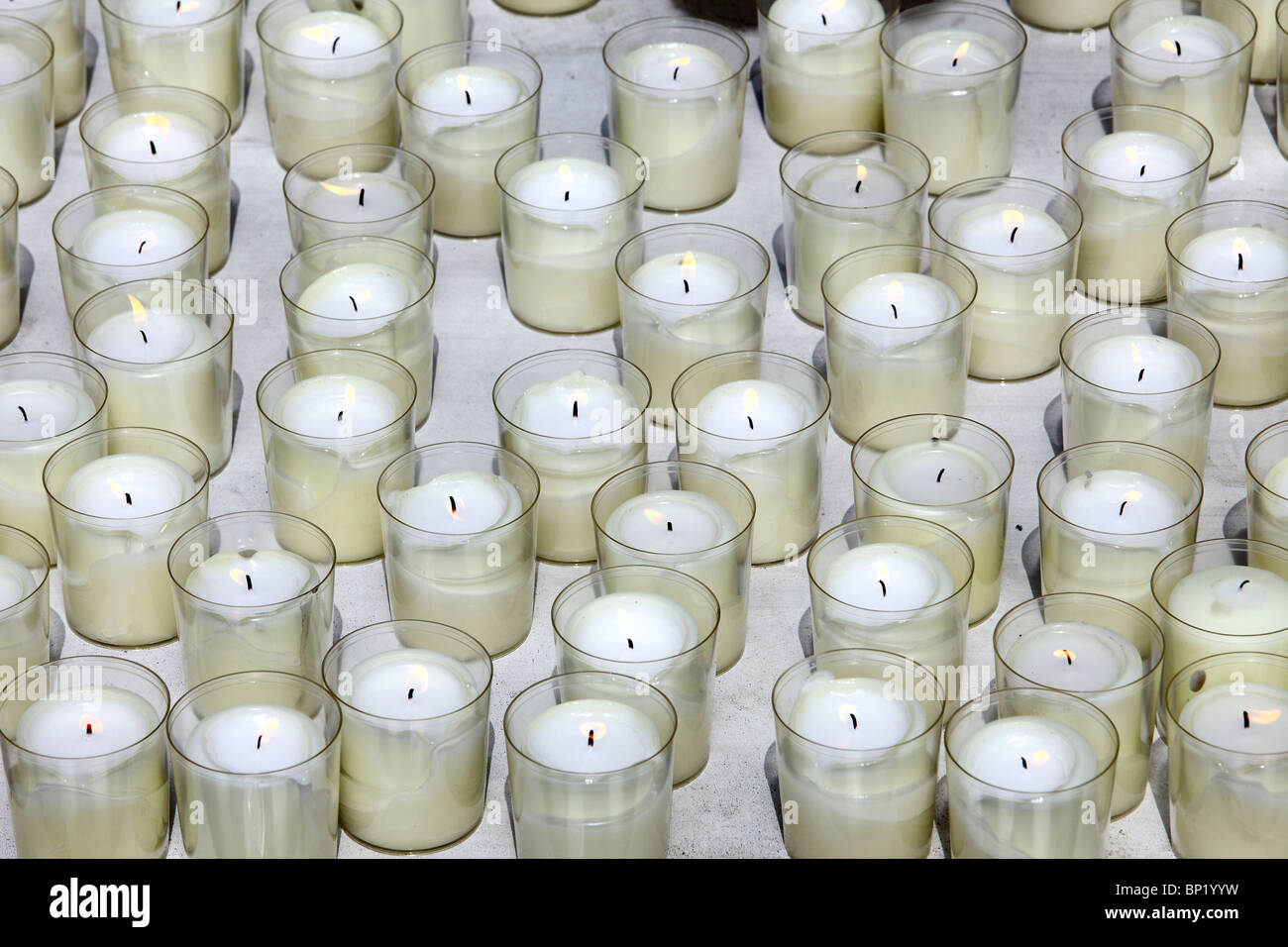 Many white candles Stock Photo - Alamy