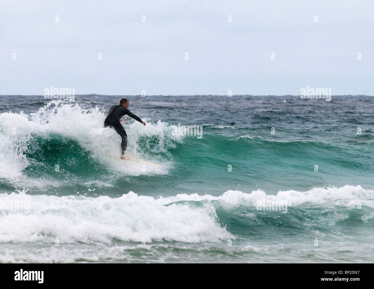 Surfer in the sea at Newquay in Cornwall Stock Photo - Alamy