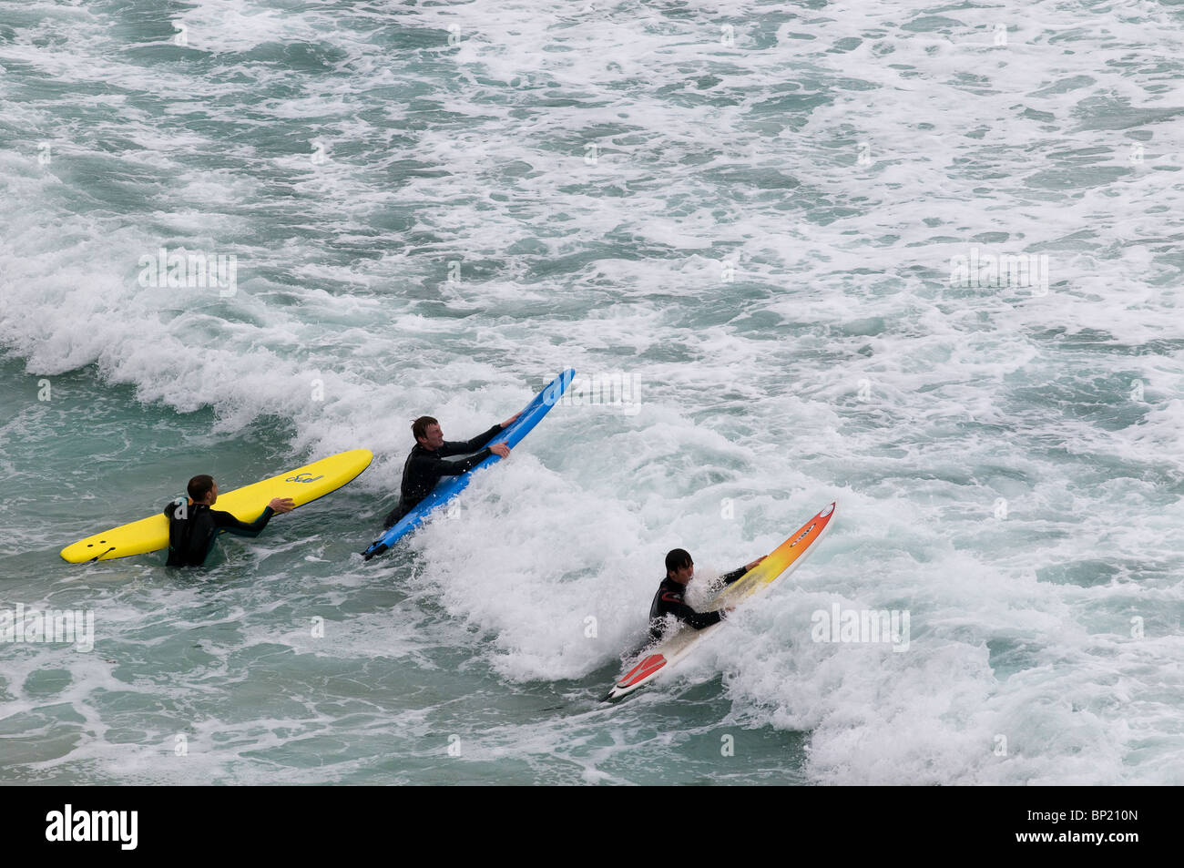 Surfers in the sea at Newquay in Cornwall Stock Photo - Alamy