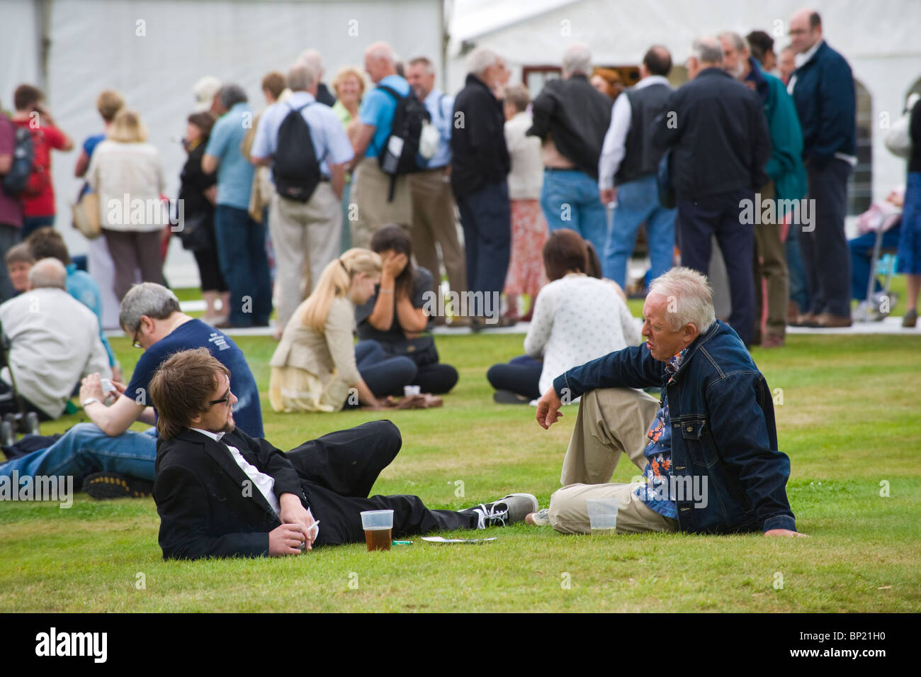 Festival goers relax and queue on the lawn at Brecon Jazz Festival 2010 ...
