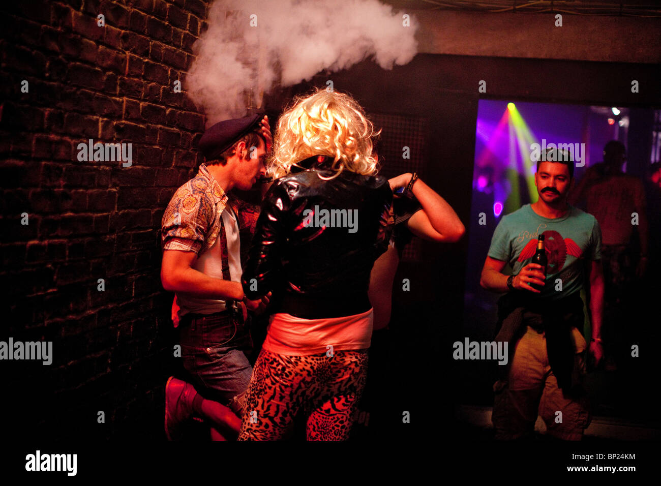 smoking outside a club night at Glastonbury Festival Stock Photo - Alamy
