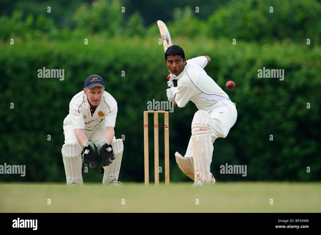 Cricket batsman in action Stock Photo - Alamy