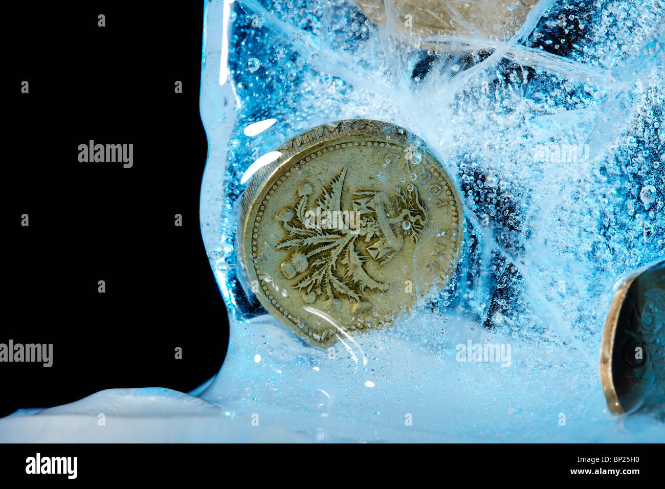 Currency Frozen in a block of Ice Stock Photo - Alamy