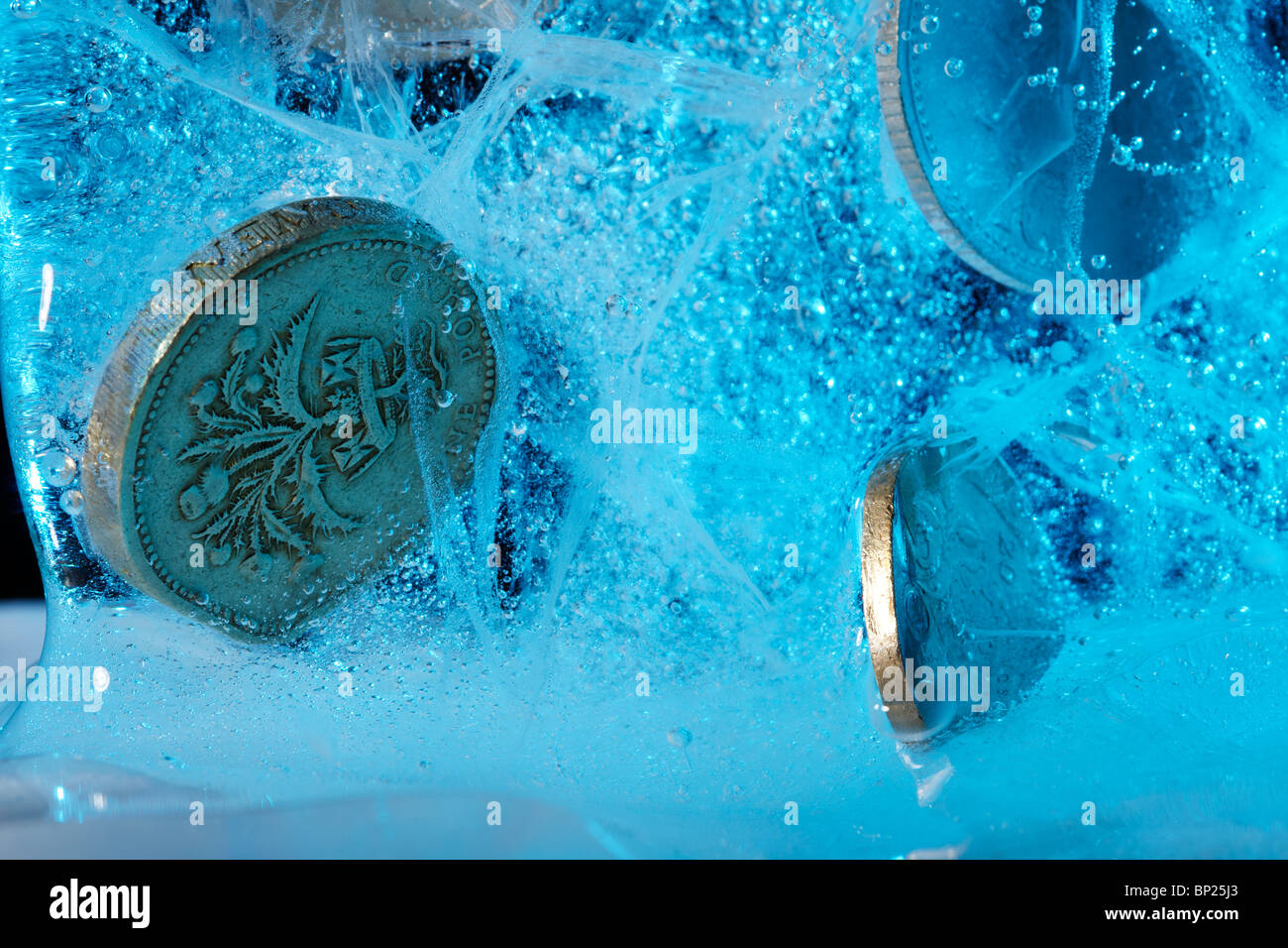Currency Frozen in a block of Ice Stock Photo - Alamy