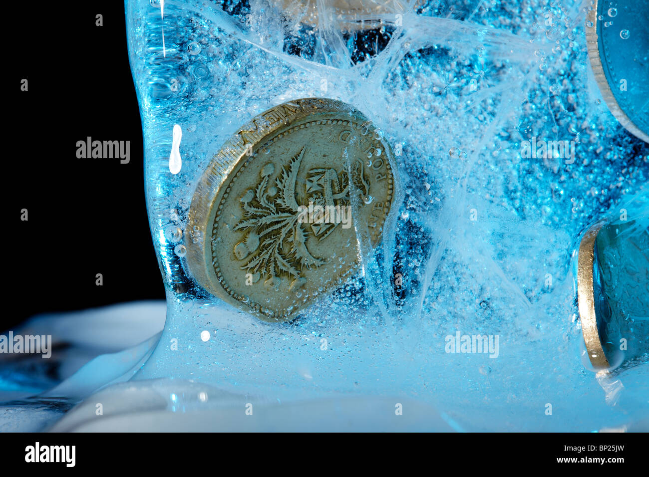 Currency Frozen in a block of Ice Stock Photo - Alamy