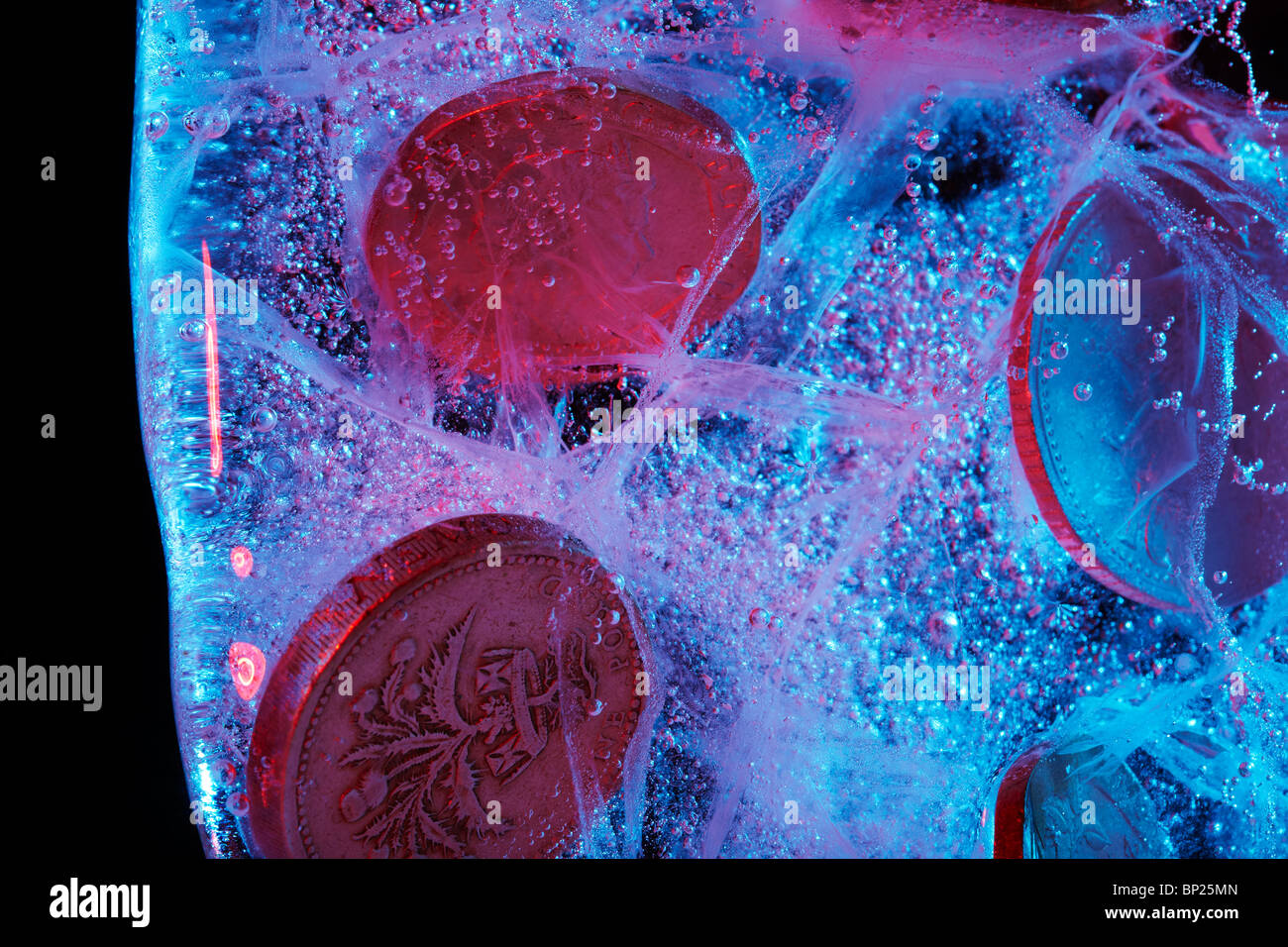 Currency Frozen in a block of Ice Stock Photo - Alamy