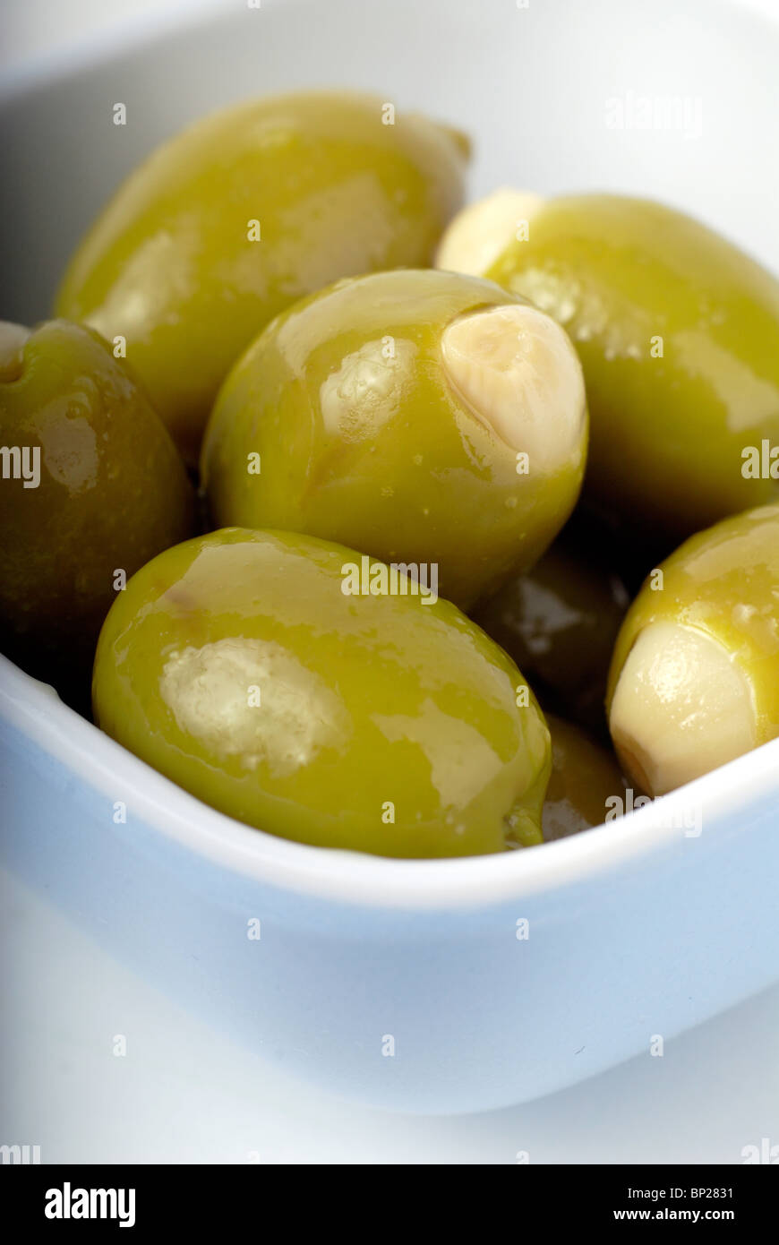 Baby Blue Bowl Of Garlic Stuffed Spanish Olives Stock Photo - Alamy