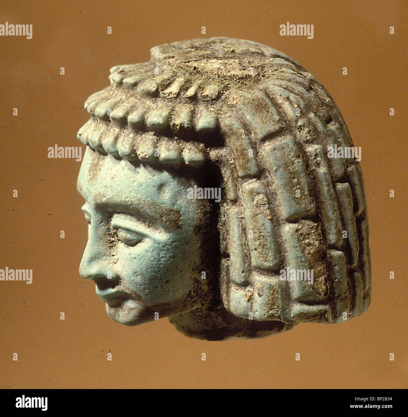 FIGURINE MADE OF PHAIANCE DEPICTING THE HEAD OF A DIGNITARY WITH A ...