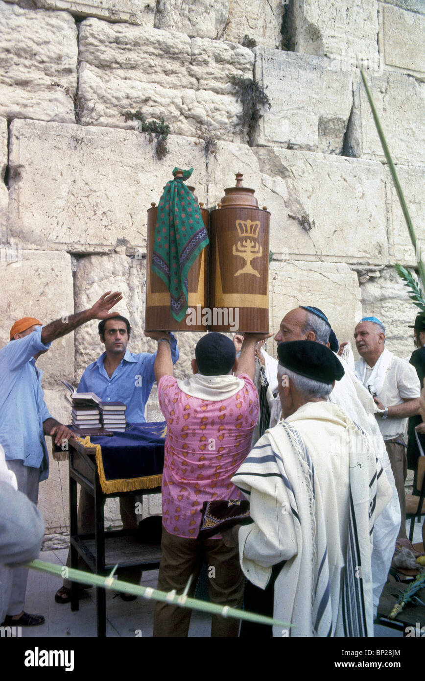 LIFTING & READING THE TORAH SCROLL AT THE WESTERN WALL. THIS IS AN OLD ...