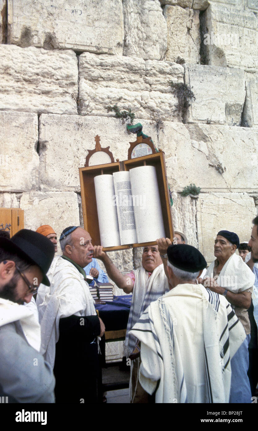LIFTING & READING THE TORAH SCROLL AT THE WESTERN WALL. THIS IS AN OLD ...