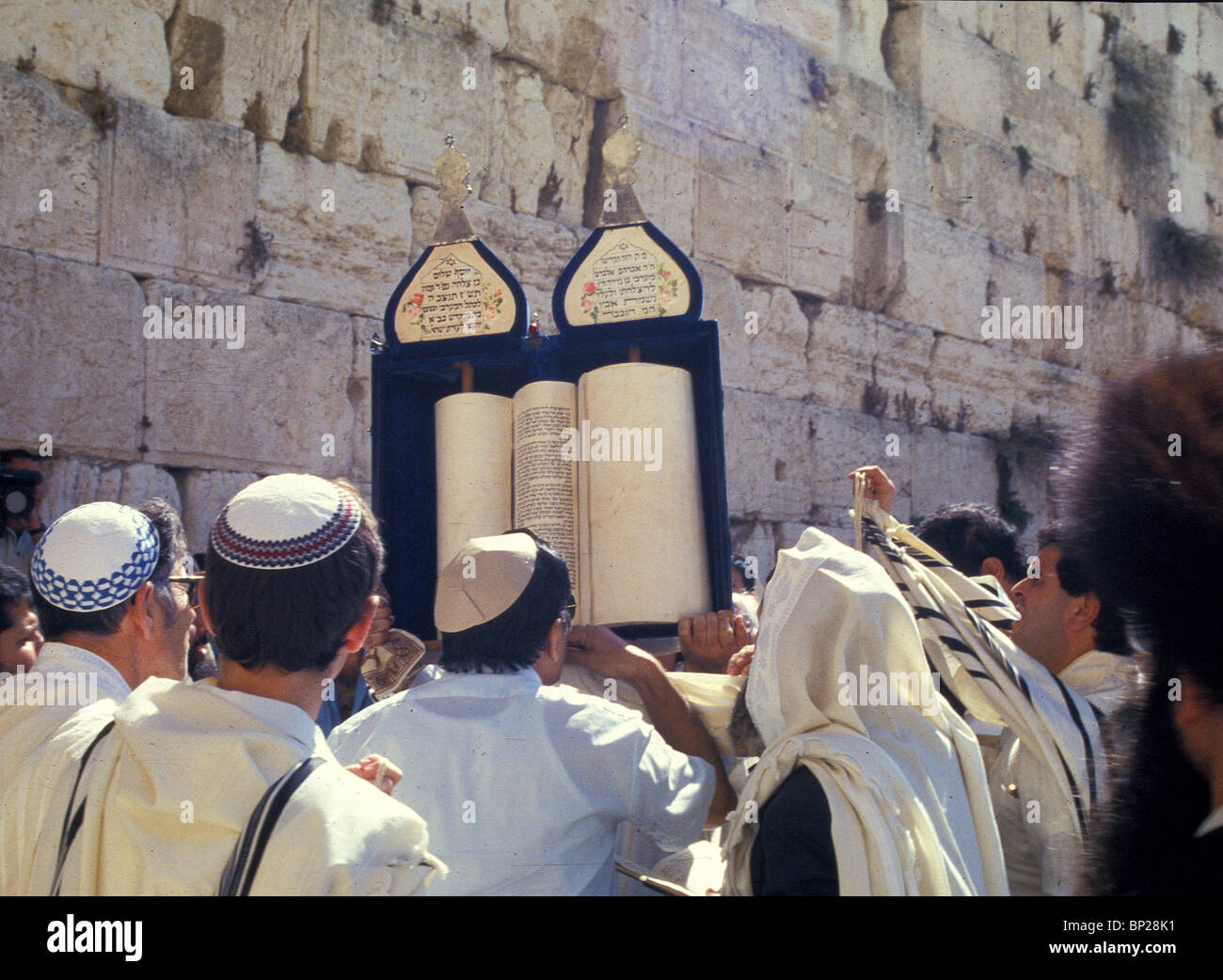 LIFTING & READING THE TORAH SCROLL AT THE WESTERN WALL. THIS IS AN OLD ...