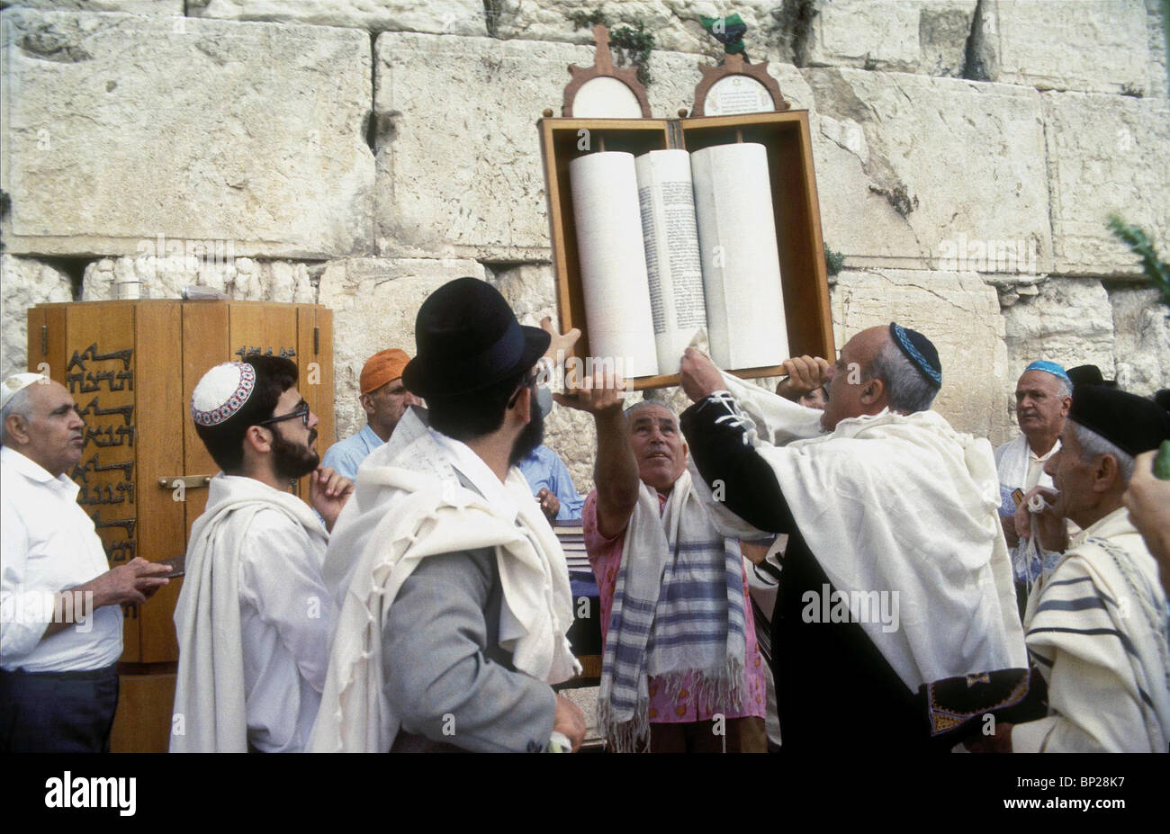 LIFTING & READING THE TORAH SCROLL AT THE WESTERN WALL. THIS IS AN OLD ...