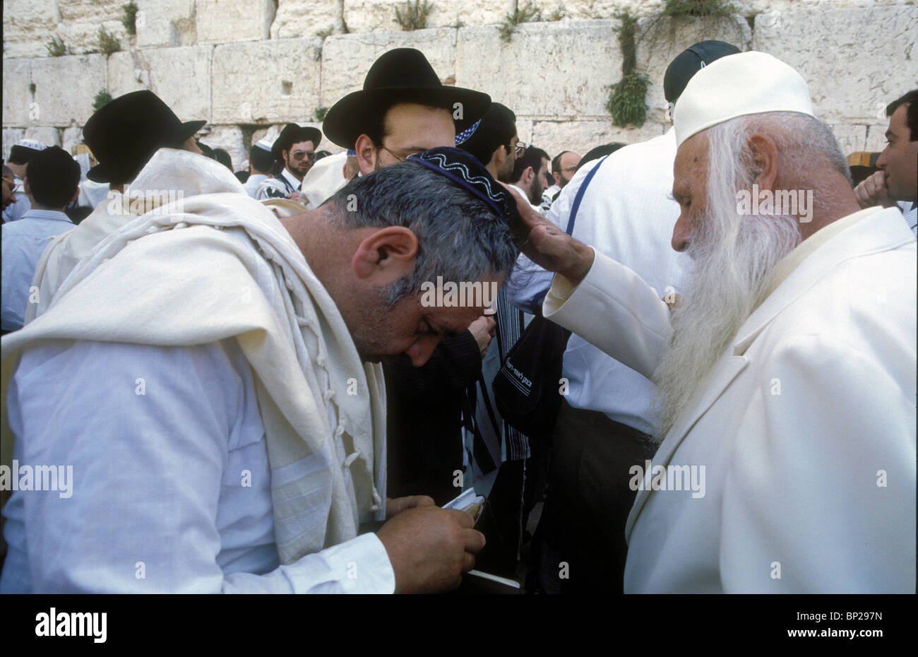 2770. RABBI BLESSING A PERSON DURING PRAYERS NEAR THE WESTERN WALL ...