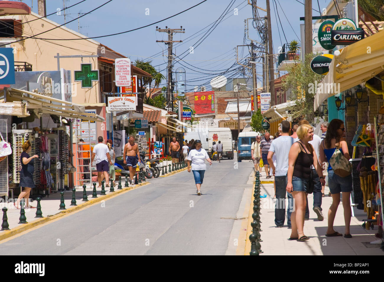 Tourists walking down the main street in Sidari on the Greek island of ...