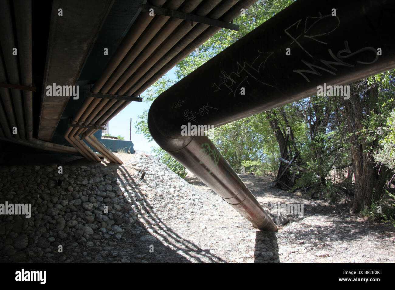 Drain pipes beneath the Alameda Bridge footbridge over the Rio Grande ...
