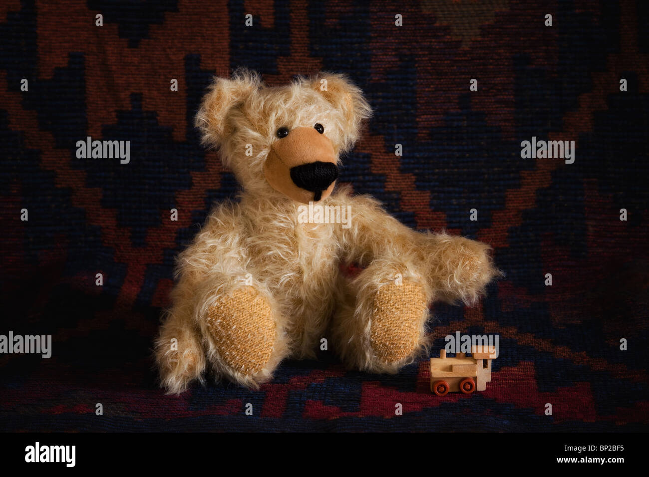 Teddy bear with toy train Stock Photo - Alamy