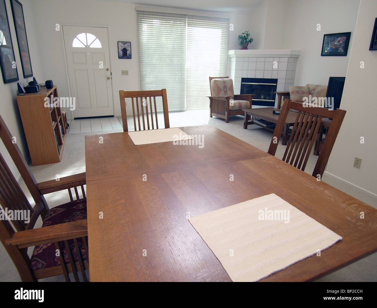 A dining room table inside a bright California townhouse Stock Photo ...