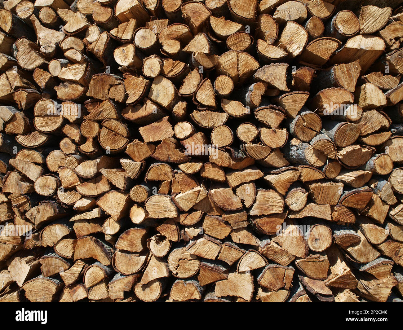 Giant stack of cut pine fire wood Stock Photo - Alamy