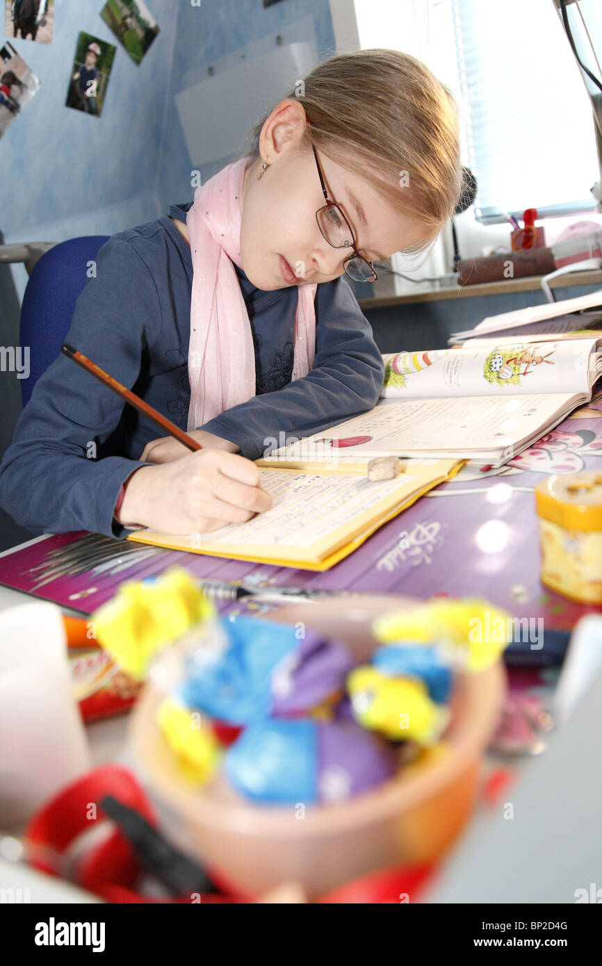 A girl doing homework in her bedroom Stock Photo - Alamy