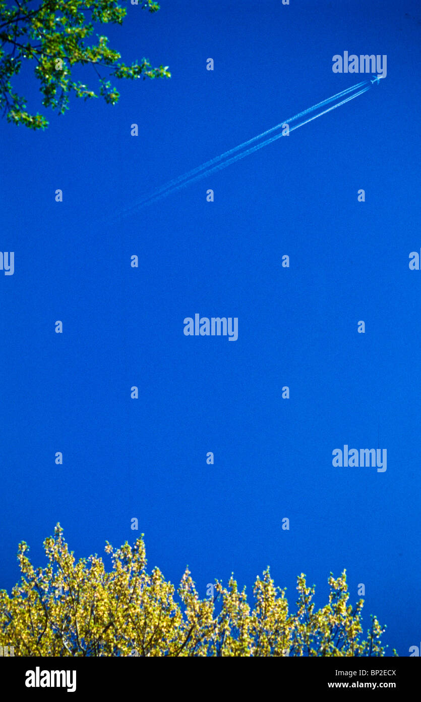 Commercial jet contrails vapor Stock Photo - Alamy