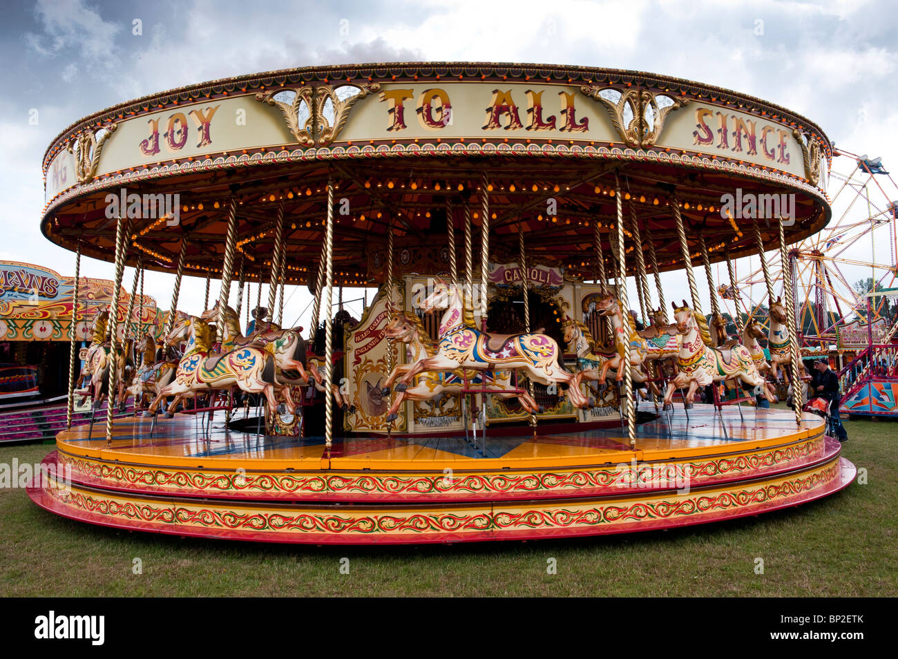 Steam Galloping horse carousel, fairground ride at a steam fair in ...