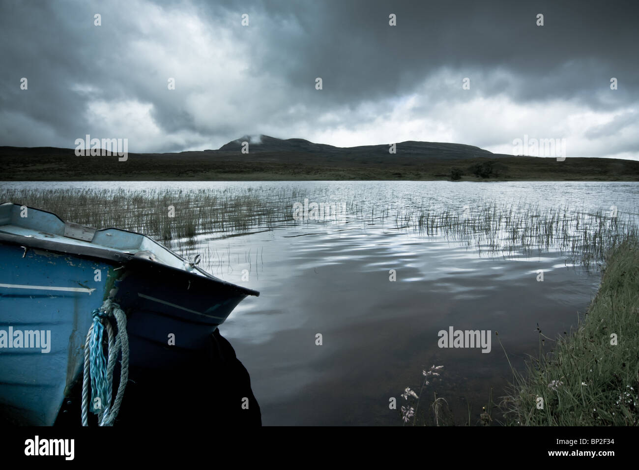 Old wooden rowing boats on loch awe in the assynt region of Sutherland ...