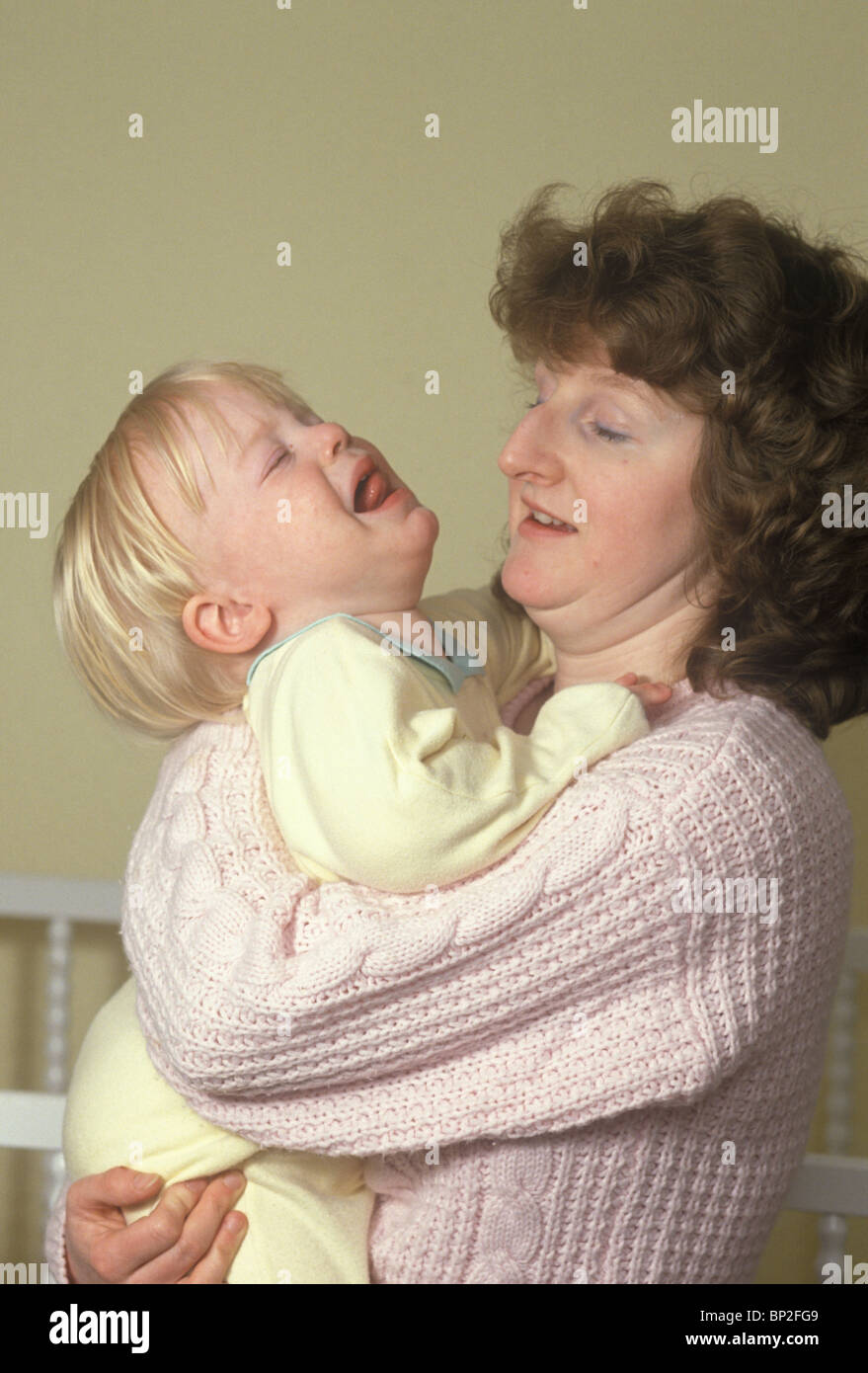 mother holding struggling toddler in throes of tantrum Stock Photo - Alamy