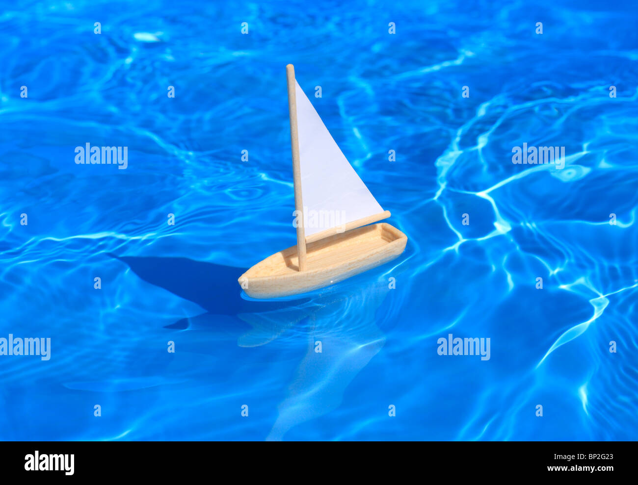Model boat in pool Stock Photo - Alamy