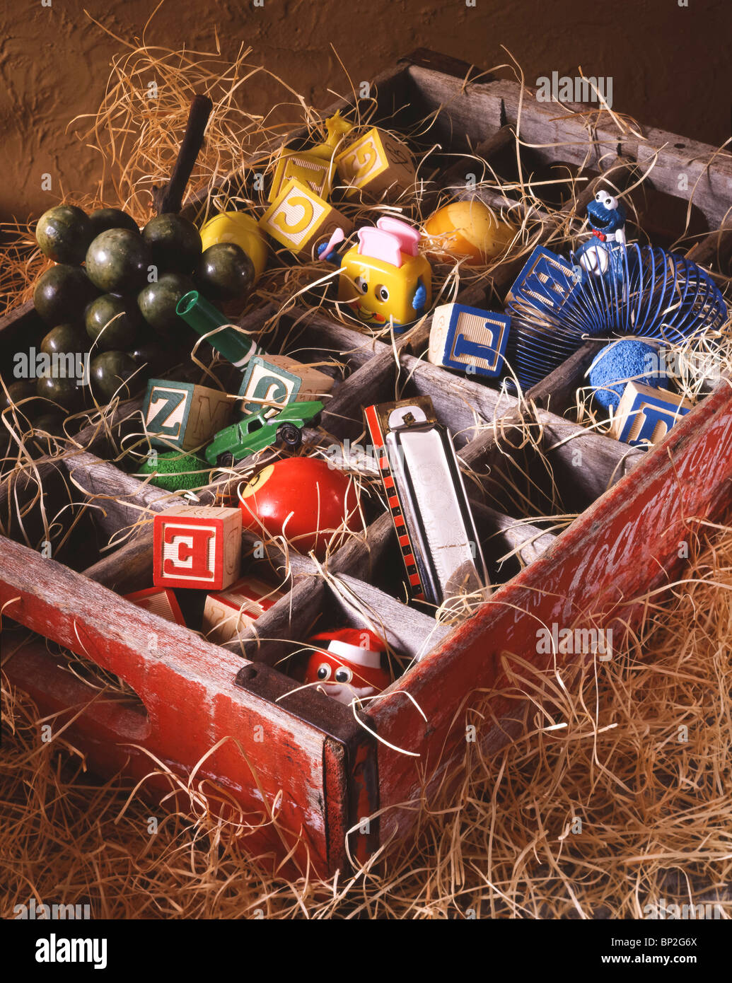 Crate full of toys Stock Photo - Alamy