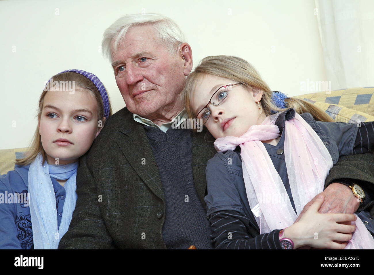 Grandfather with two granddaughters Stock Photo - Alamy