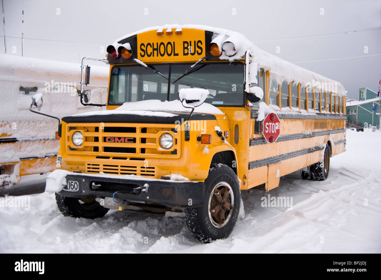 A school bus parked on the snow covered road in Churchill, Manitoba ...
