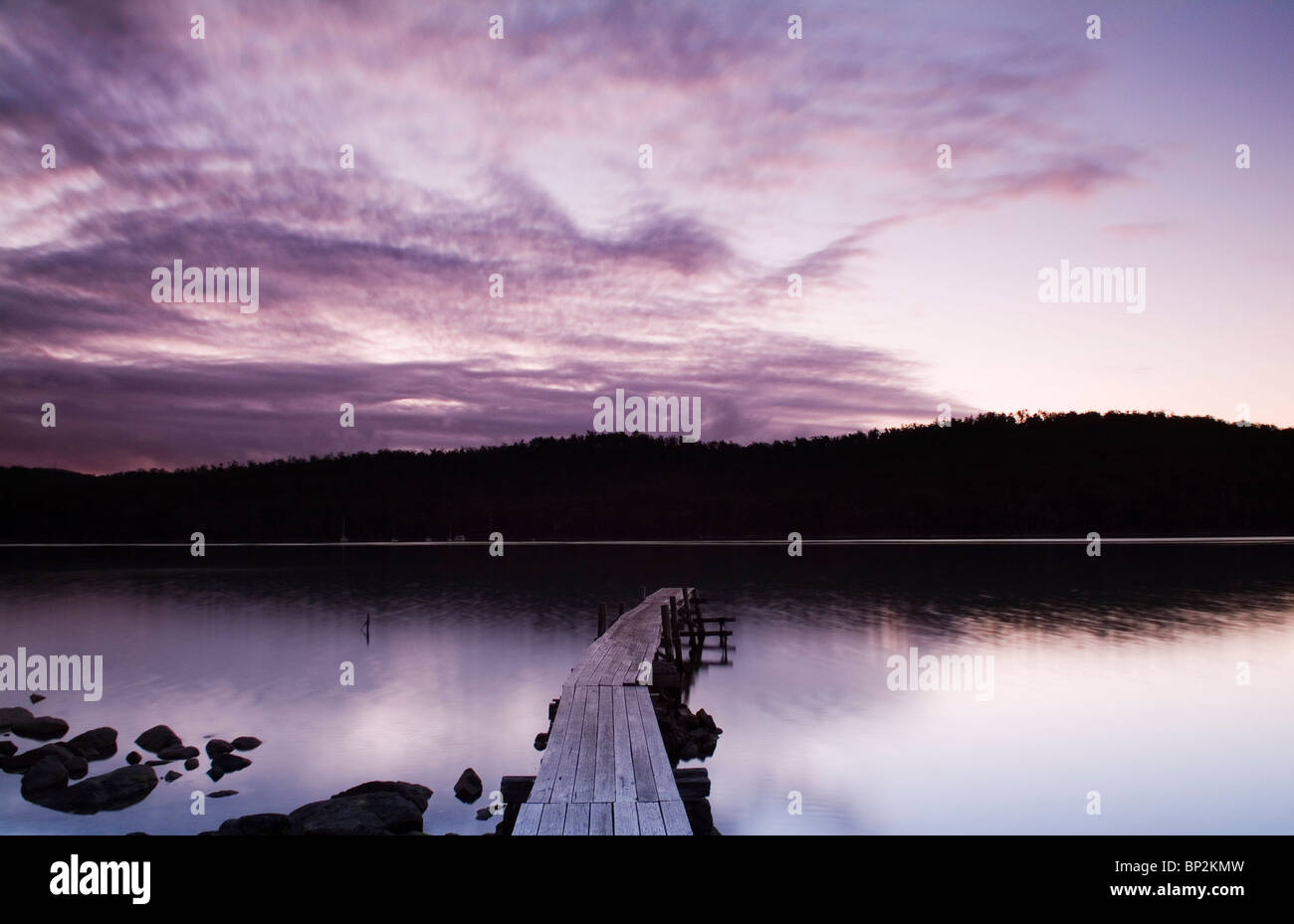 Beautiful purple sunset over waves hi-res stock photography and images ...